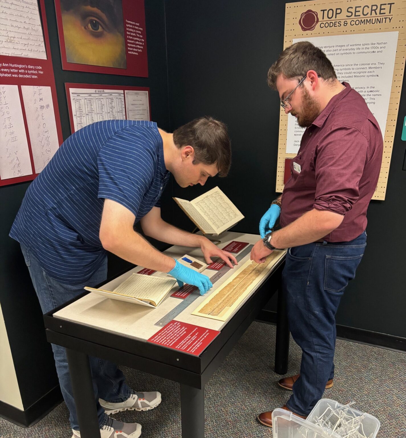 Dangremond interns Jack and Joel set up collection items for the Nawrot ...